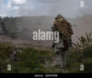 Operators from the 20th Special Forces Group provide fire support to an ...