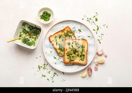 Composition with slices of toasted garlic bread and parsley on color ...