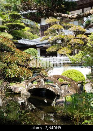 Sukumo, Japan - April 8, 2018: Traditional Japanese garden with pond on ...