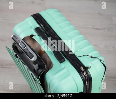 A close-up of a broken plastic suitcase Stock Photo - Alamy