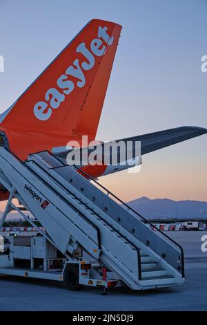 Close-up of an easyJet plane tail fin outside the easyFood and easyBus ...