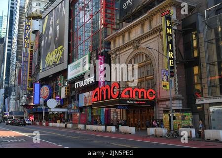 People walk past AMC Theatres in Times Square on August 8, 2022 in New ...