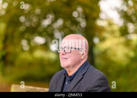 A shallow focus shot of bald senior Caucasian man with glasses in the ...