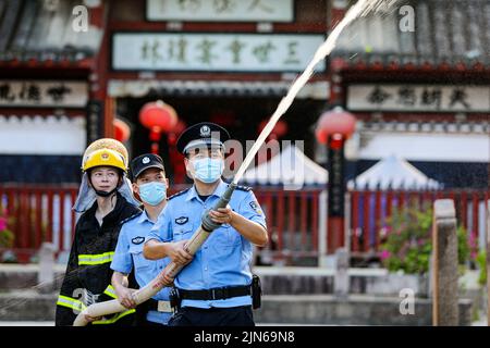 FUZHOU, CHINA - AUGUST 9, 2022 - Police conduct a fire prevention drill ...