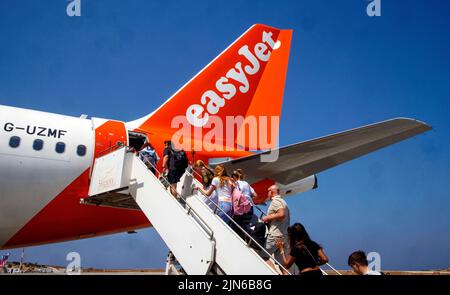 Passengers boarding an easyJet aircraft at Santorini airport Stock ...