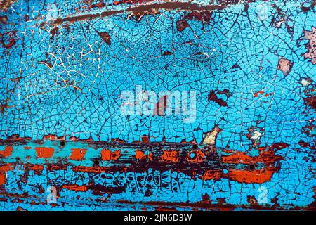 Enamelled colorful cracked and peeling surface of old motorcycle. Rusty ...