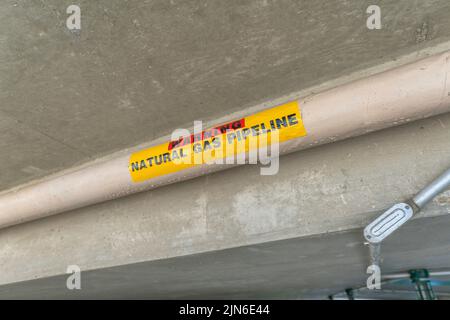 natural gas pipelines with warning signs sprawl across the desert in ...