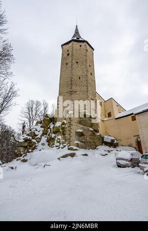 Medieval castle Rostejn in winter during snowfalling. Castle is placed ...