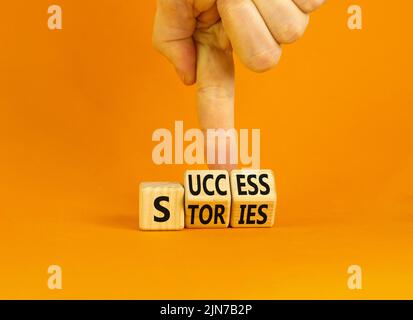 Success stories symbol. Concept words Success stories on wooden cubes ...