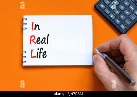IRL in real life symbol. Concept words IRL in real life on white paper ...