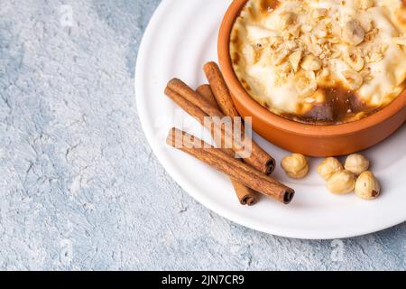 Turkish Dessert Sutlac (Fırın Sütlaç) on an isolated white background ...