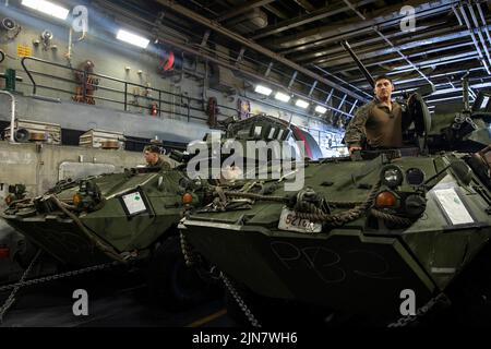 Marines aboard a LAV-25 Light Armored Vehicle (LAV) keep a sharp watch ...