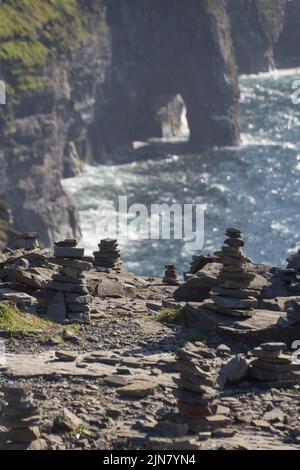 A vertical shot of a rock balancing in Isle of Wight, England Stock ...