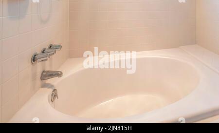 Panorama Sun flare Shower tub with beige tiles surround and wall ...