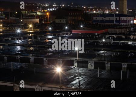 Beautiful night landscape garages stand in rows and a lantern that ...