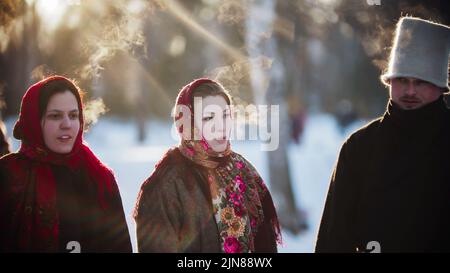 Russian folklore - young russian people standing outdoors at winter ...