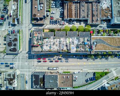 An aerial view of cityscape Vancouver surrounded by buildings and trees ...