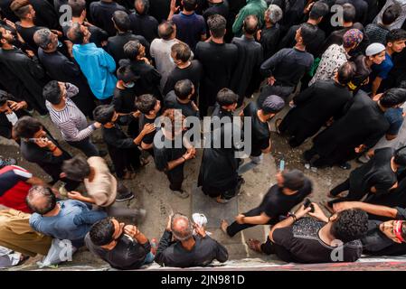 Shia Muslims beat chests as they walk during Ashura procession. Ashura ...