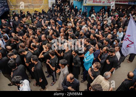 Shia Muslims beat chests as they walk during Ashura procession. Ashura ...