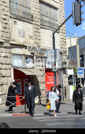 Pedestrians crossing the road at the ultra-Orthodox neighborhood of ...