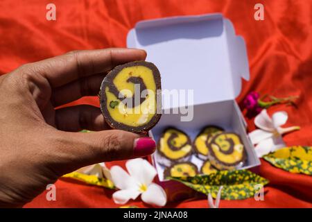 Chocolate burfi or Kesar chocolate barfee with silver vark given in ...