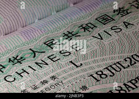 Chinese visa sticker in passport Stock Photo - Alamy