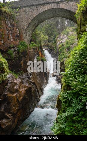 Waterfalls and Slate stone bridge over Afon (River) Cwm Llan showing ...