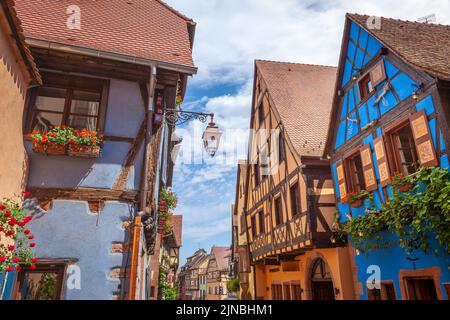 Riquewihr alsatian architecture at springtime with flowers, Eastern ...