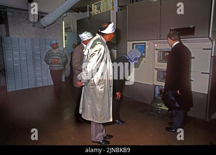 Sikh Men Watching Coffin In Furnace at a Crematorium Surrey England ...