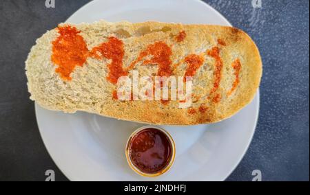 Iberian cachuela bread toast. Single-serve cachuela container Stock ...