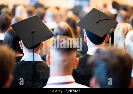 Mannheim, Germany. 29th July, 2022. Graduates wear a graduation hat at ...