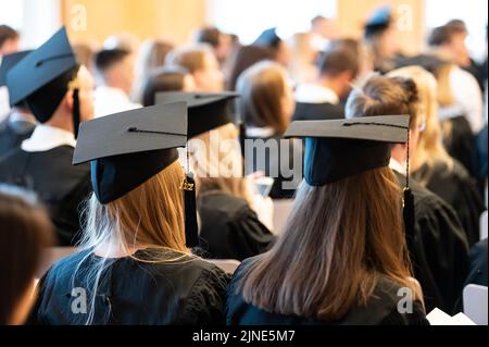 Mannheim, Germany. 29th July, 2022. Graduates wear a graduation hat at ...