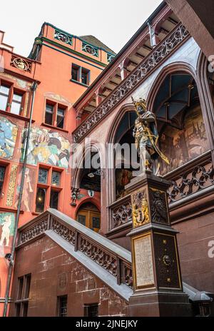 Medieval courtyard of Basel Town Hall with colorful frescoes ...