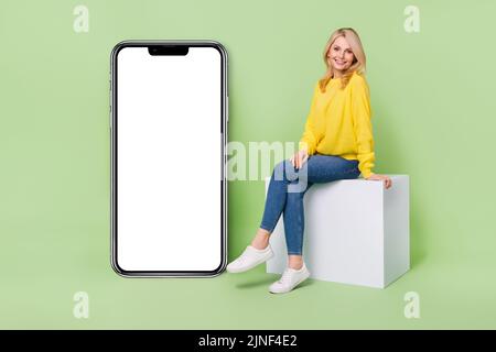 Photo of senior lady sit podium mobile phone poster search web netbook ...