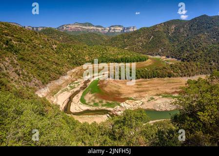 Dry tail meander of the Susqueda reservoir during the summer drought of ...