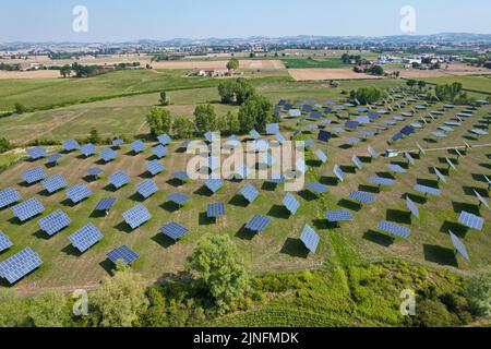 Blue rotating solar panels tilted axis tracker, future energy concept ...