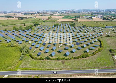 Blue rotating solar panels tilted axis tracker, future energy concept ...