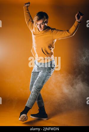 Muscular dance performer practicing dance moves at the studio Stock ...