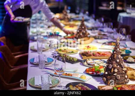 Christmas festive feast with a beautiful craft tree in the center Stock ...