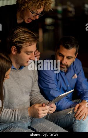 Four amazing business people are having a discission about the plans ...