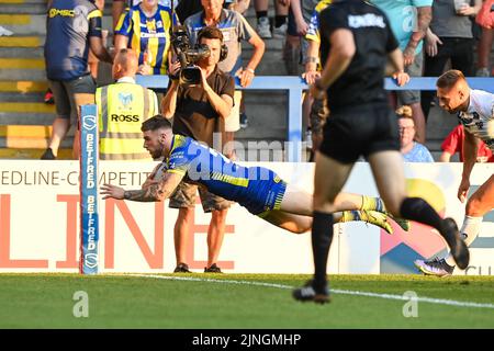 Connor Wrench #23 of Warrington Wolves goes over for a try to make it ...