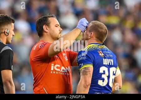 Matt Dufty #36 of Warrington Wolves limps off the pitch after injuring ...
