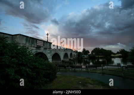 Moody Landscape Picture Of Chertsey Bridge Under Interesting Lighting Moody Landscape Picture Of Chertsey Bridge Under Interesting Lighting