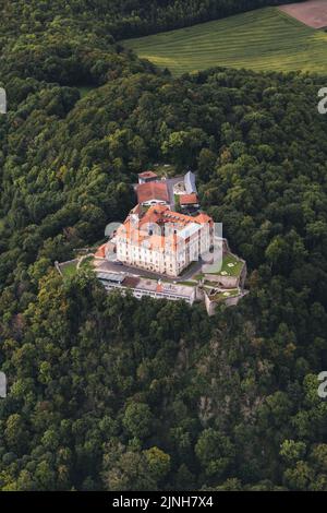 An aerial view of Bieberstein Castle with forest in Rhine, Germany ...