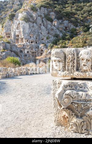 Masks and rock tombs in Myra, Turkey. Ancient tomb by Lycia in Fethiye ...