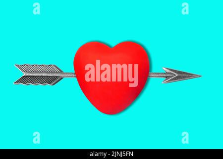 Heart shape pierced with a steel bow arrow isolated on white background ...