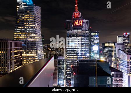A beautiful shot of illuminated buildings in New York City at night ...