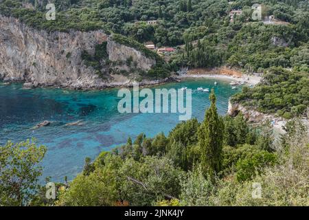 View with Ampelaki Beach in Palaiokastritsa famous resort town on Greek ...