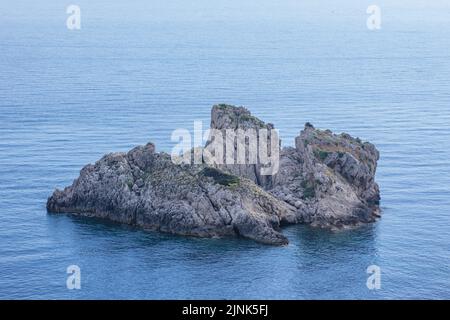Skeludi islet seen from shore in Palaiokastritsa famous resort town on ...