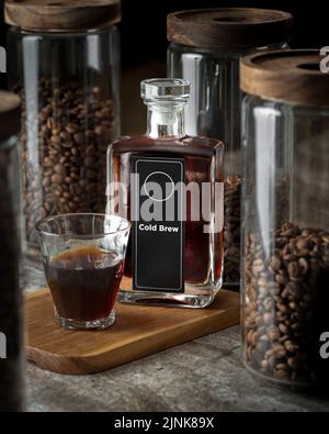 Glass with cold brew and coffee beans on yellow background Stock Photo ...